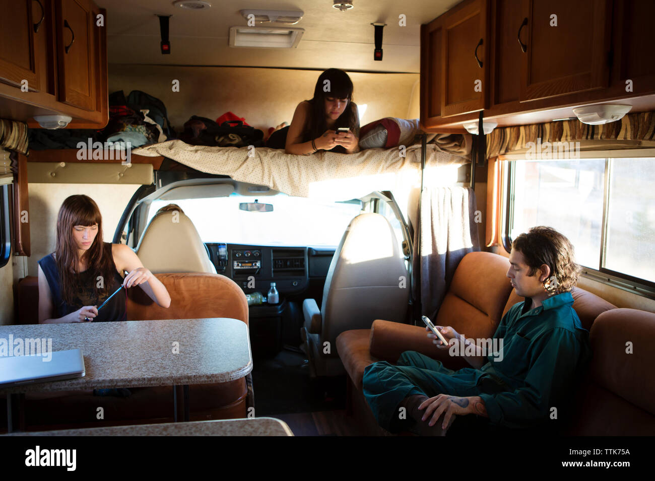 Friends in camper van Stock Photo - Alamy