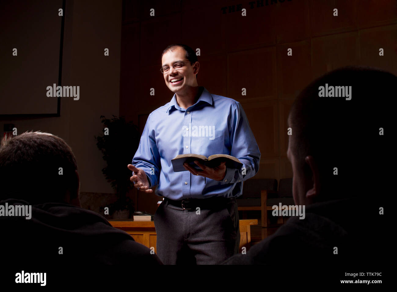 Happy male professor teaching in college classroom Stock Photo - Alamy