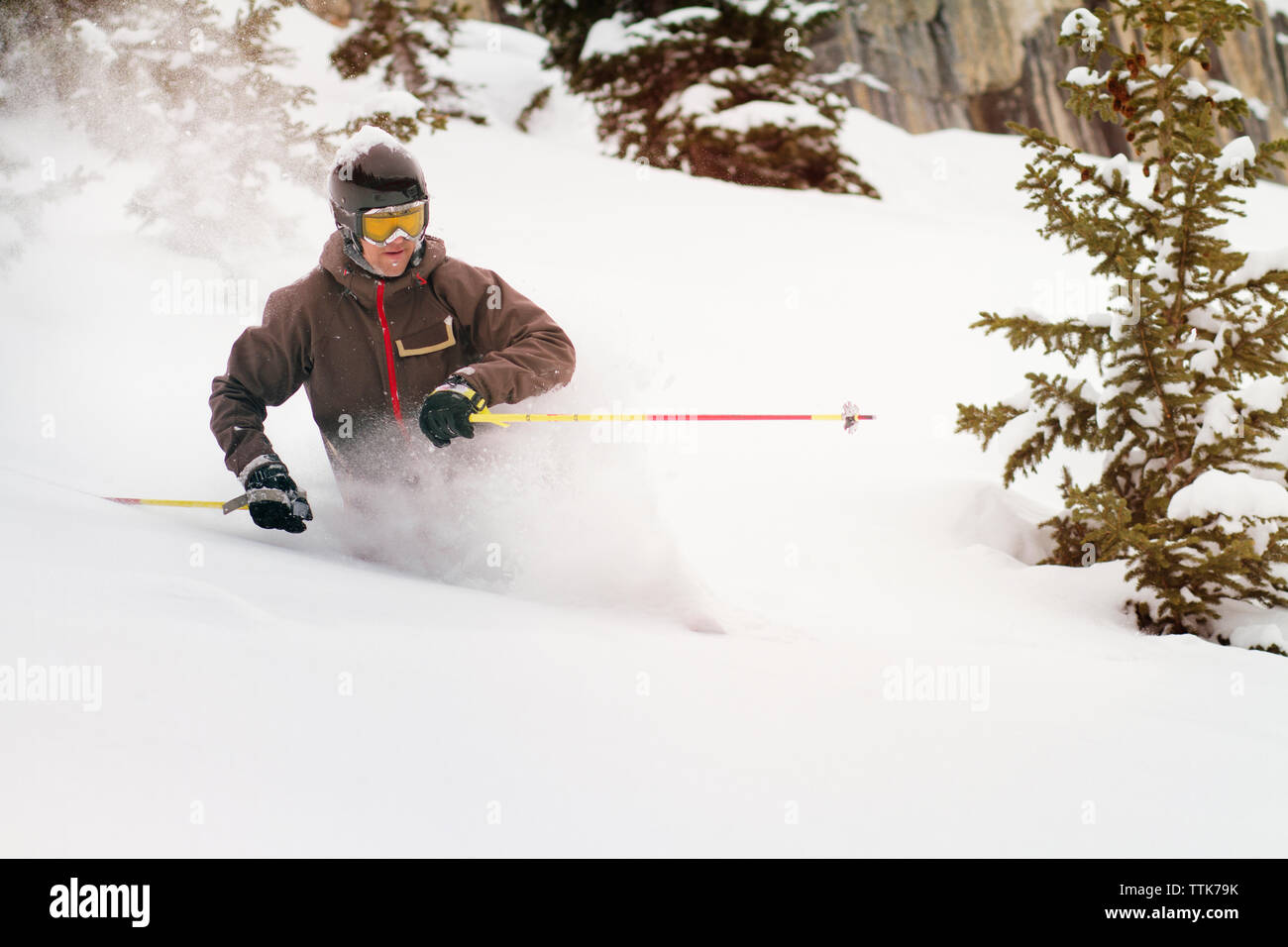 Skier skiing on snowy slope on mountain Stock Photo - Alamy