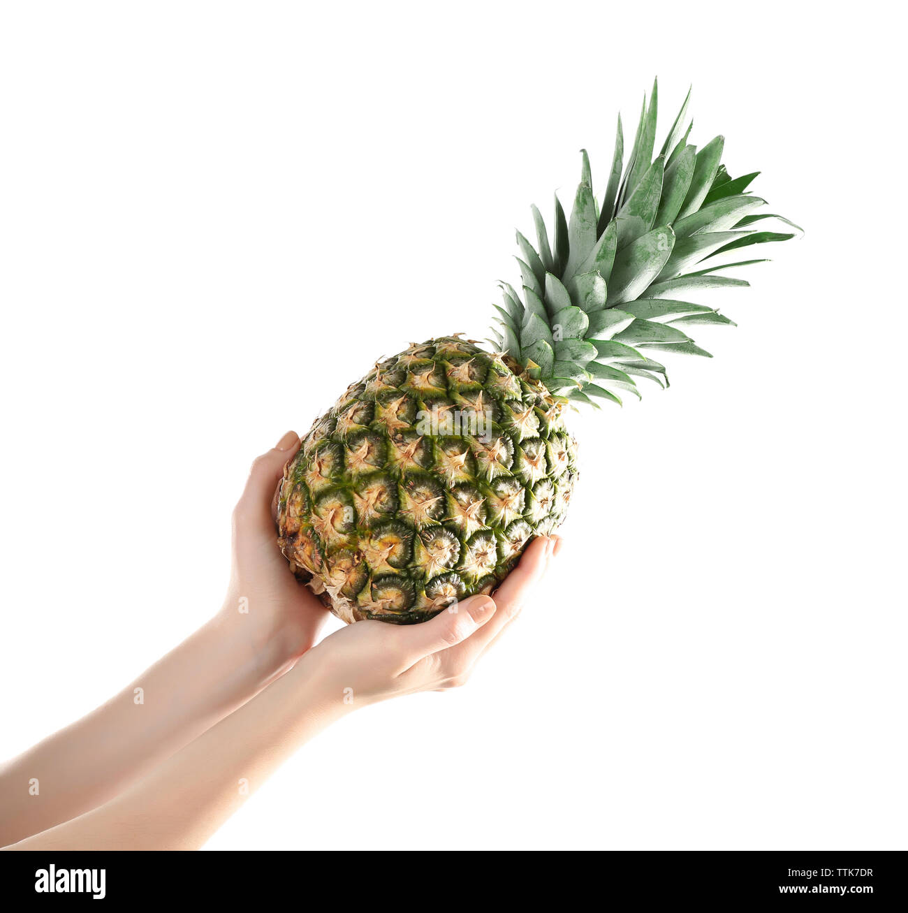 Woman hands holding pineapple on white background Stock Photo - Alamy