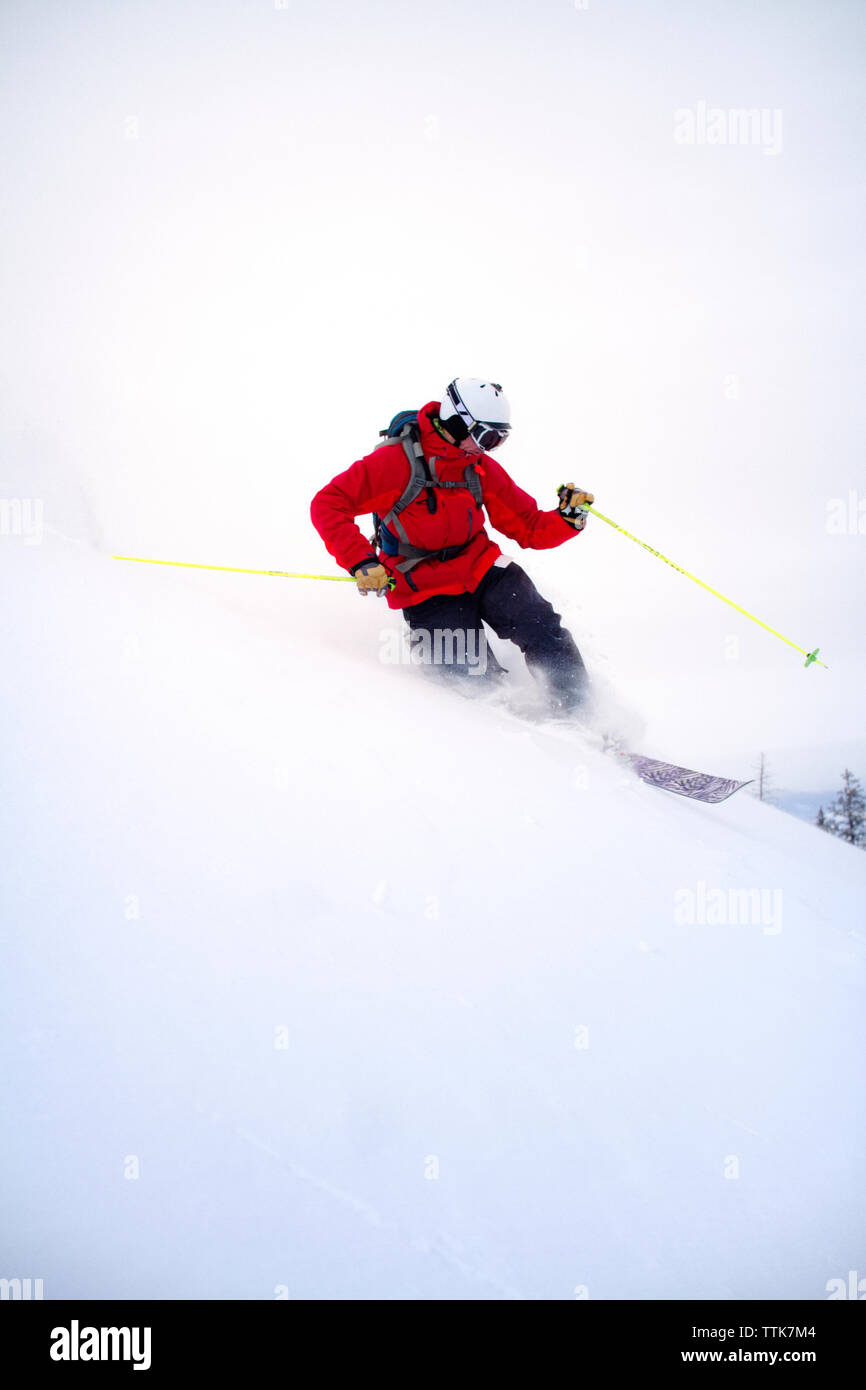 Mid adult male skiing on slope hi-res stock photography and images - Alamy