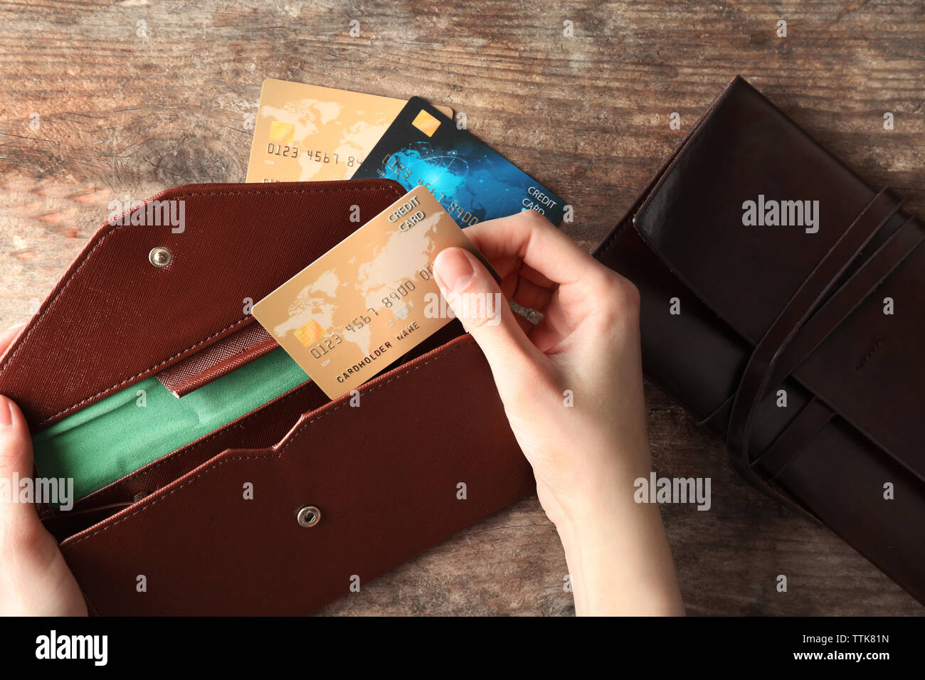 Woman taking credit card hi-res stock photography and images - Alamy