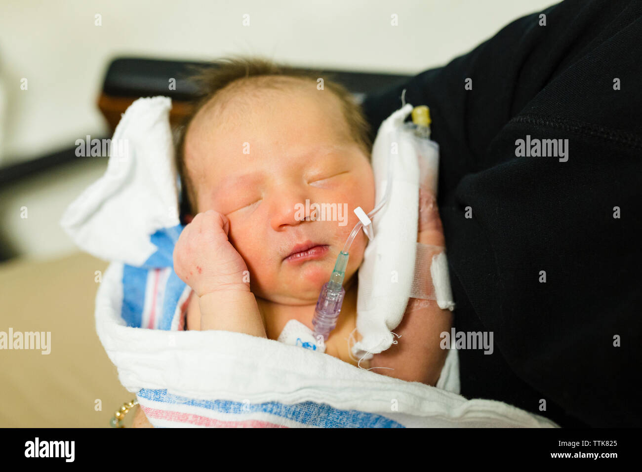 Newborn baby being held in hi-res stock photography and images - Alamy