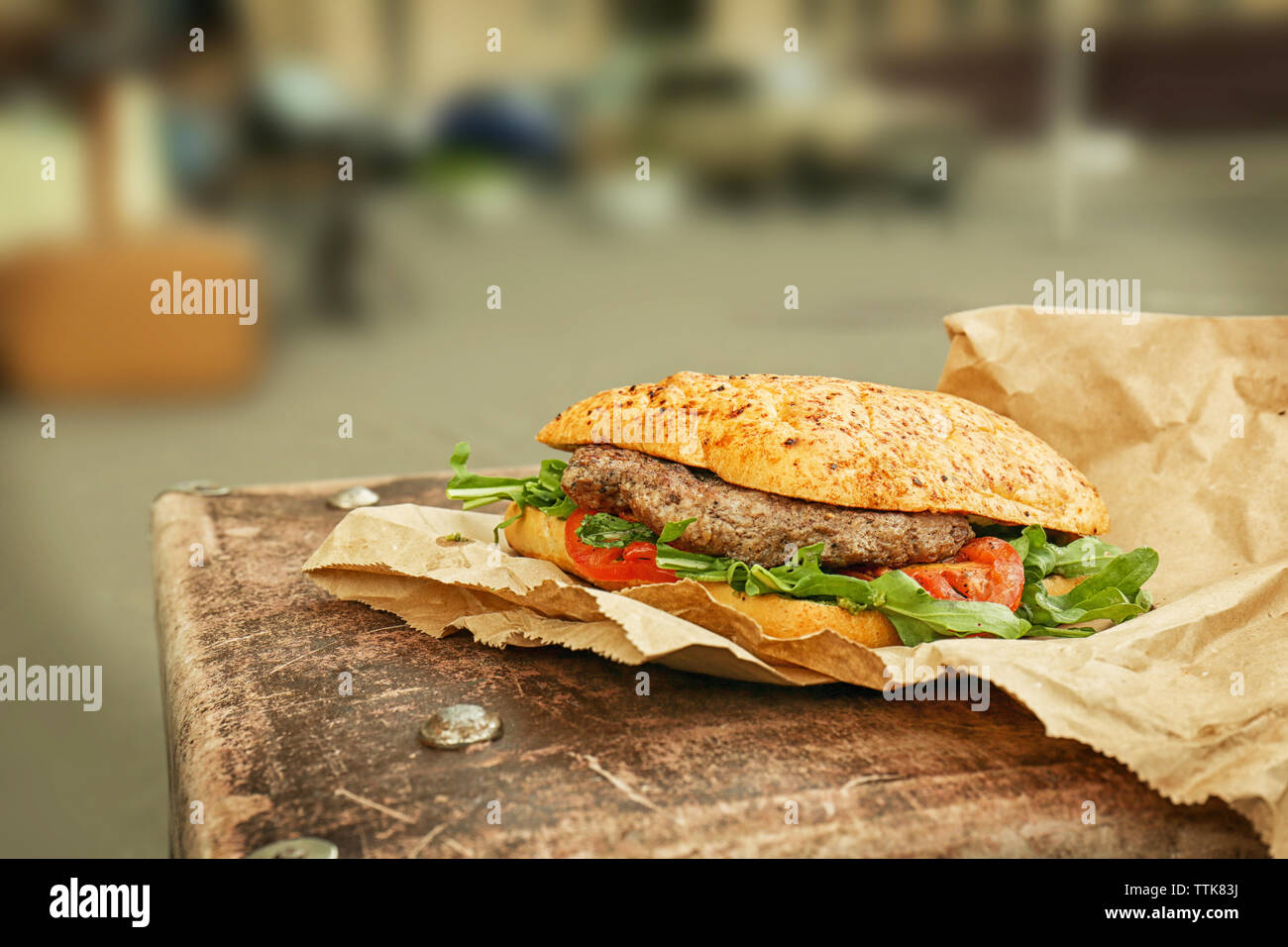 Street food burger on city background Stock Photo - Alamy