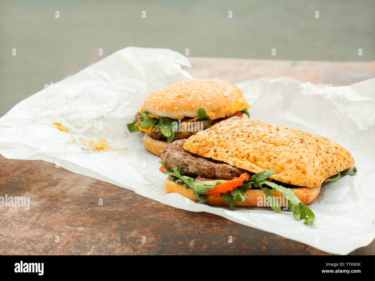 Street food burgers on paper Stock Photo - Alamy