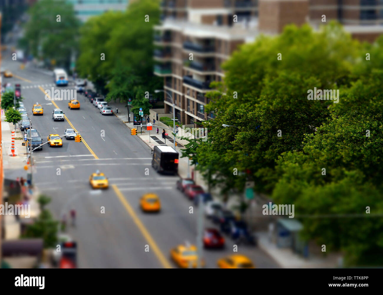 Tilt-shift image of vehicles on city street Stock Photo - Alamy