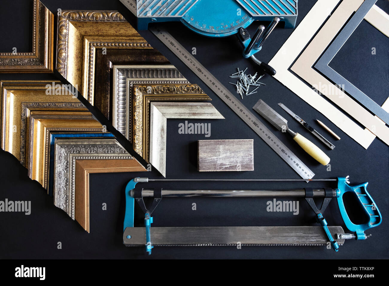 Overhead view of picture frame samples and work tools on table Stock ...