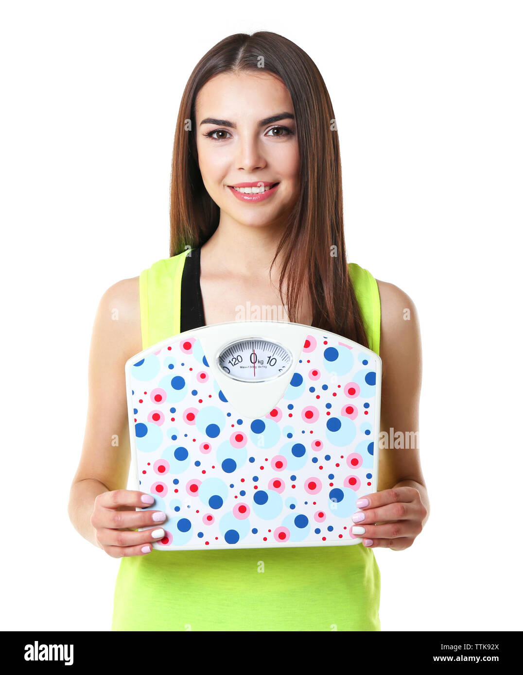 Young beautiful woman with scale isolated on white Stock Photo - Alamy