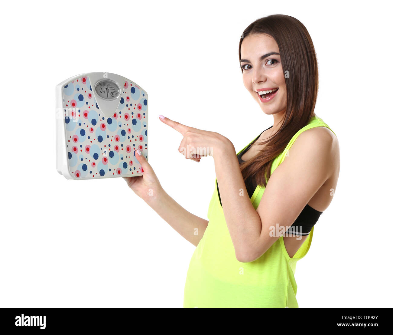 Young beautiful woman with scale isolated on white Stock Photo - Alamy