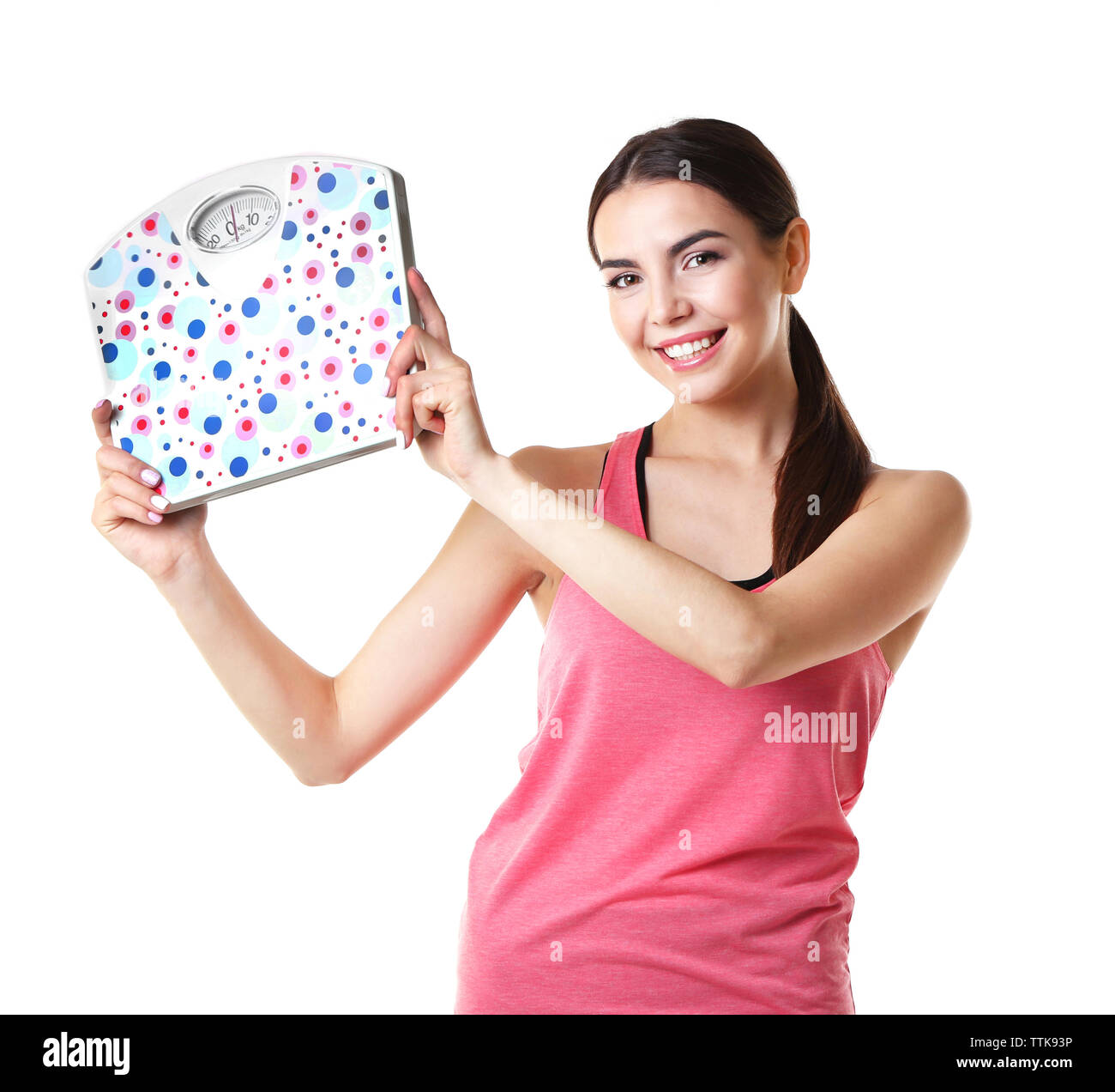 Young beautiful woman with scale isolated on white Stock Photo - Alamy