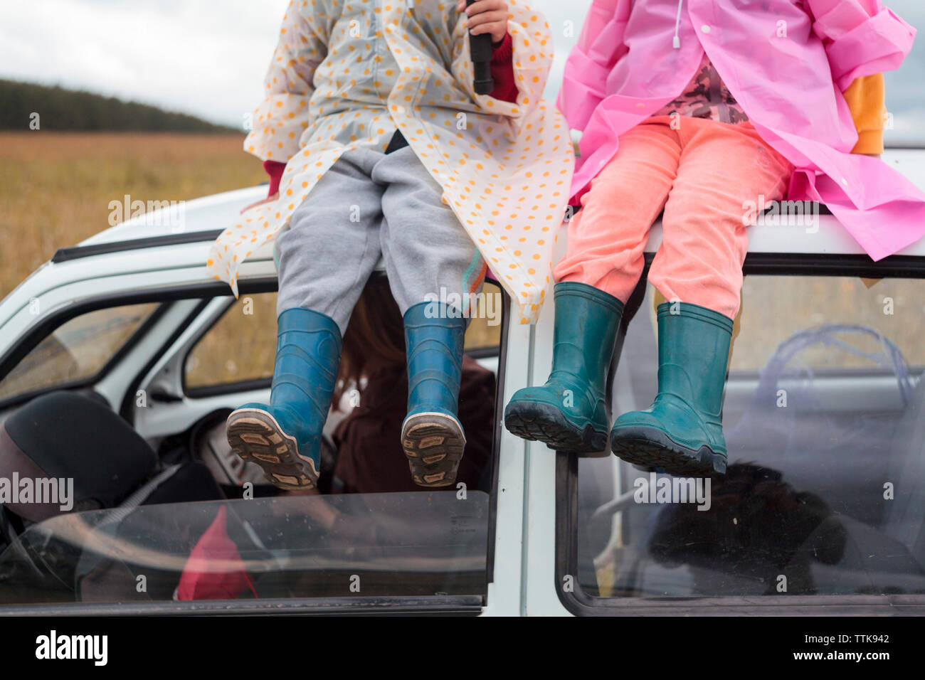 Girl on car roof hi-res stock photography and images - Alamy