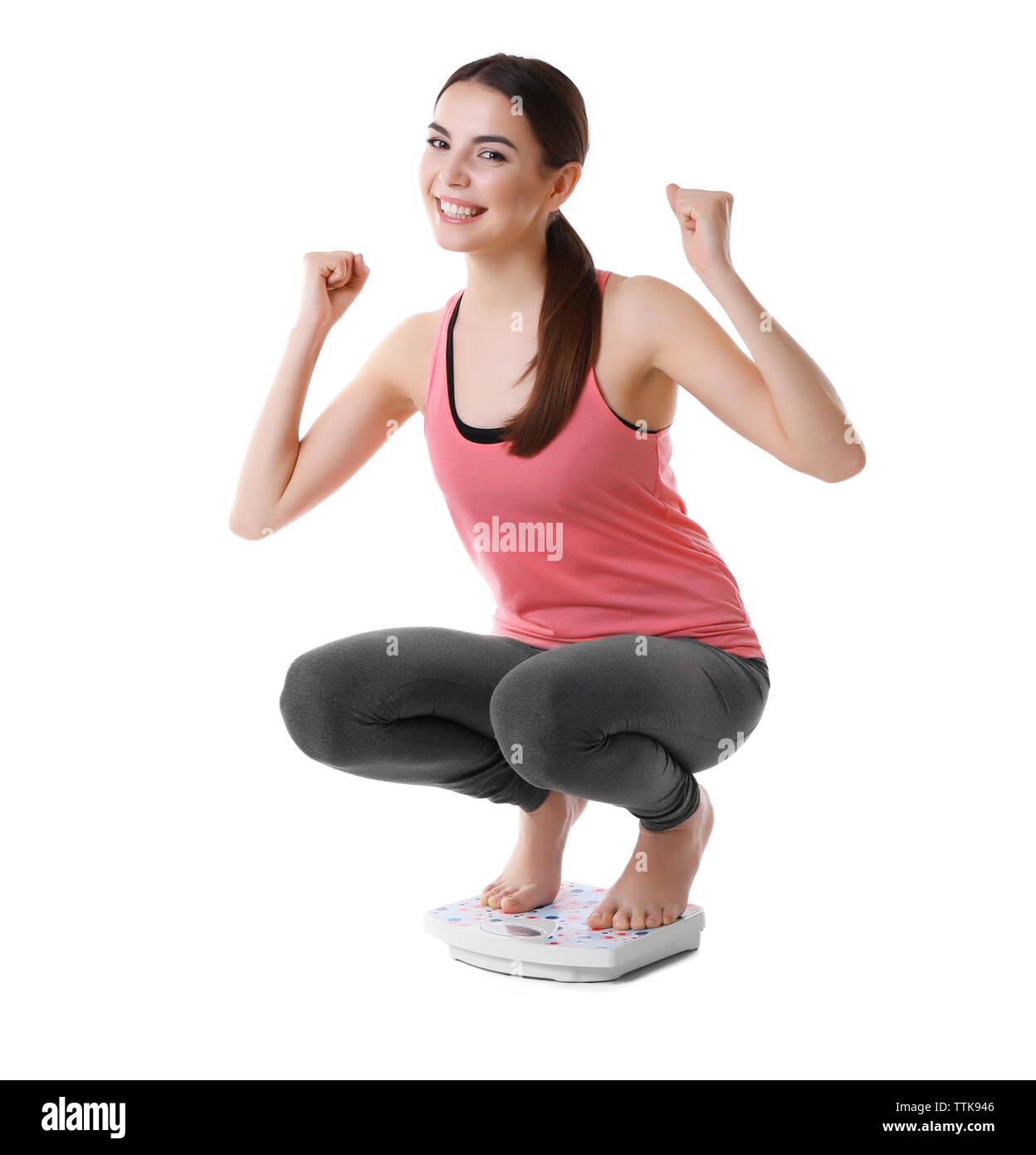 Woman standing on scale isolated on white Stock Photo - Alamy