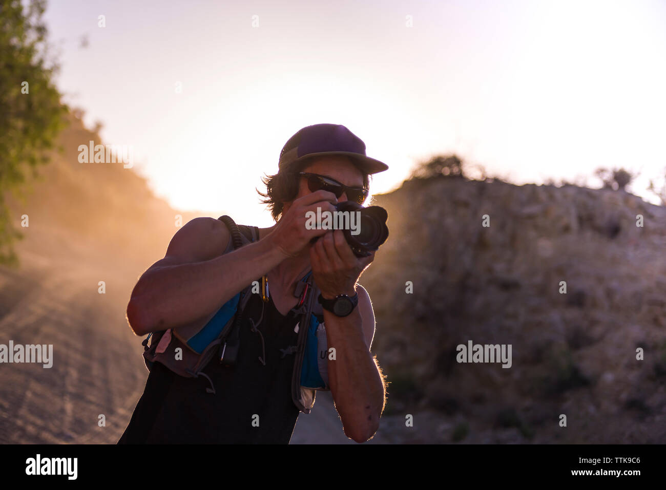 Travel Photographer Capturing landscape mountains using DSLR Stock ...