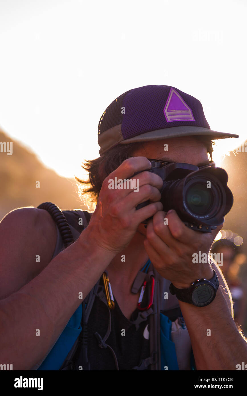 Travel Photographer Capturing landscape mountains using DSLR Stock ...
