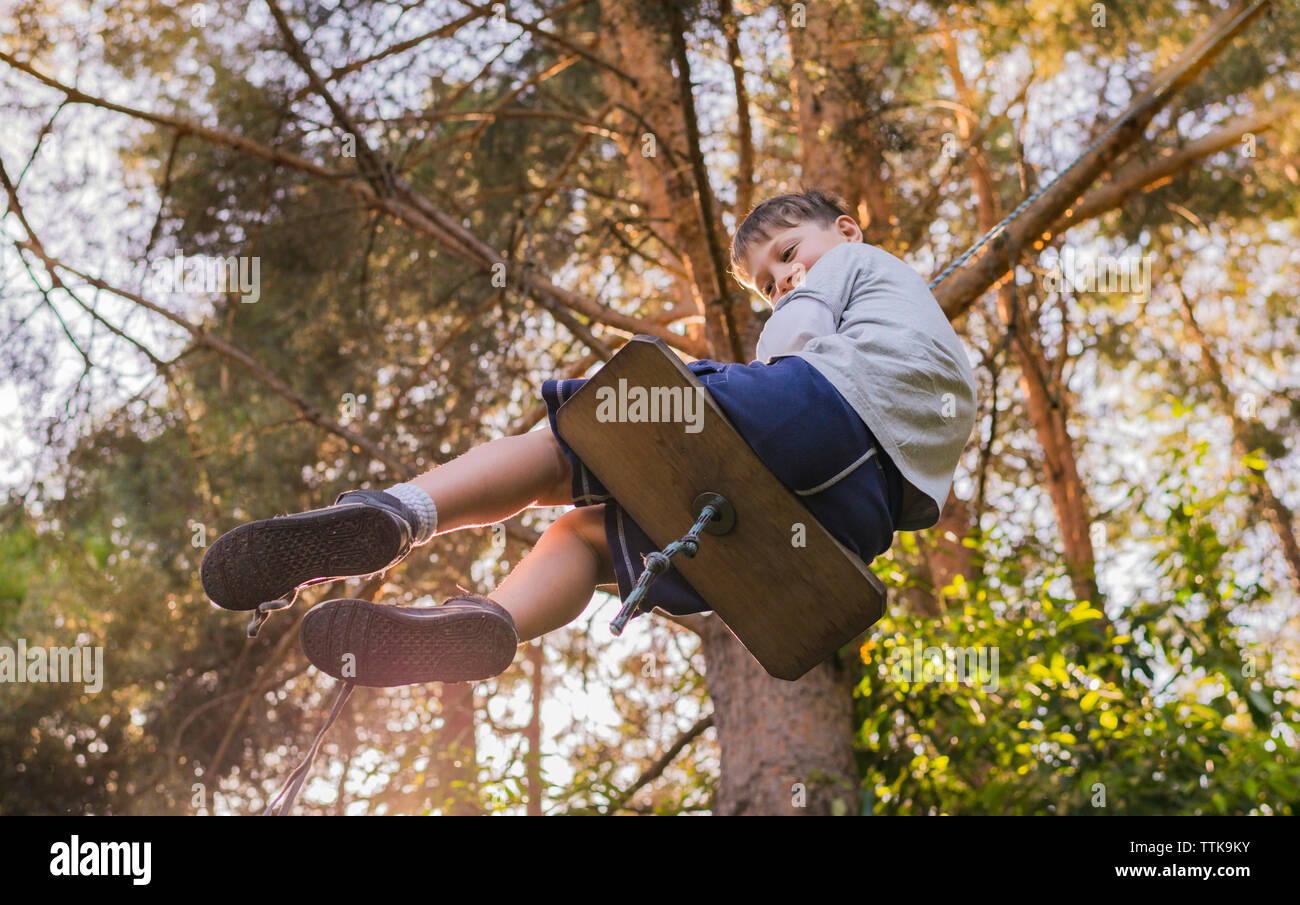 Boy swing low angle hi-res stock photography and images - Alamy