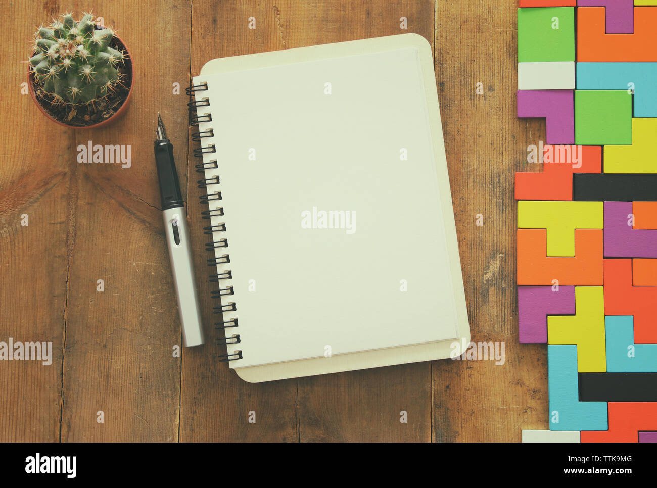 Open notebook with empty pages over wooden old office desk table. Top ...