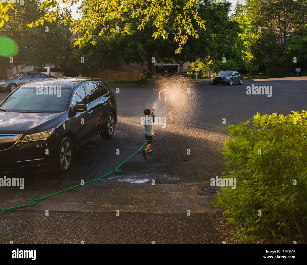Boy spraying hi-res stock photography and images - Alamy