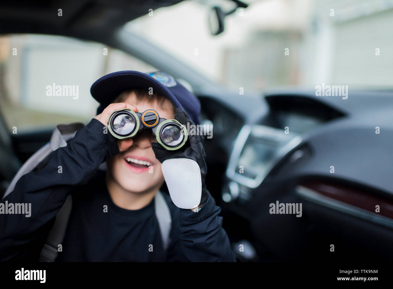 Looking through binoculars in car hi-res stock photography and images ...