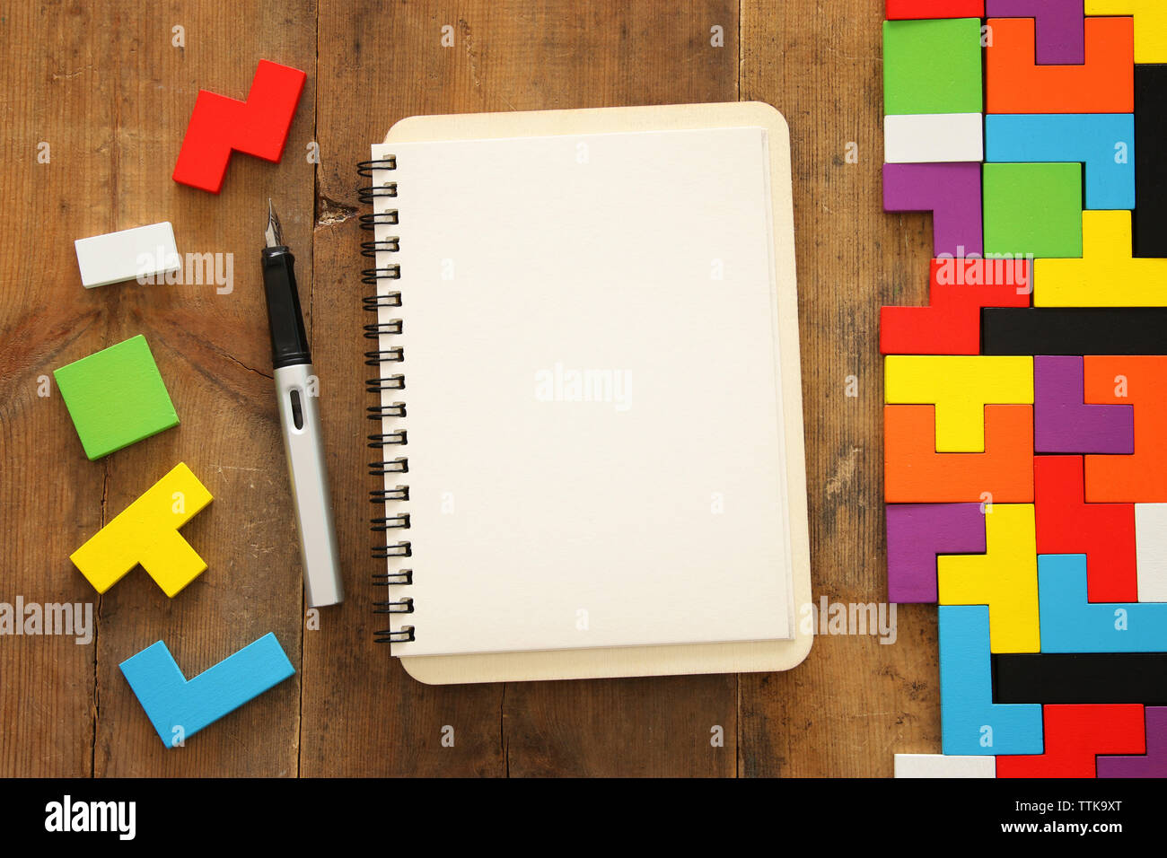 Open notebook with empty pages over wooden old office desk table. Top ...