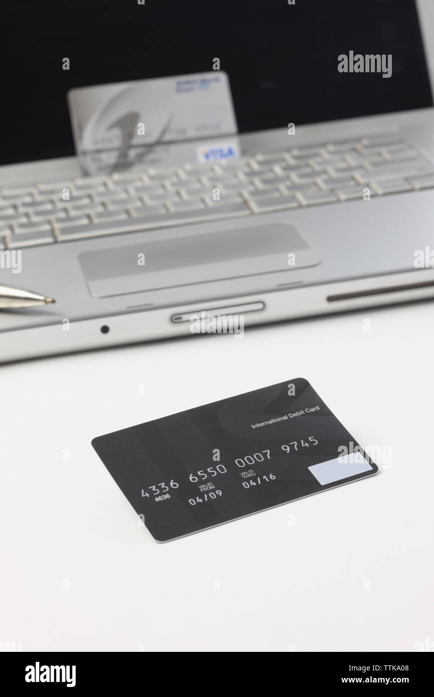 Credit cards with a laptop Stock Photo - Alamy