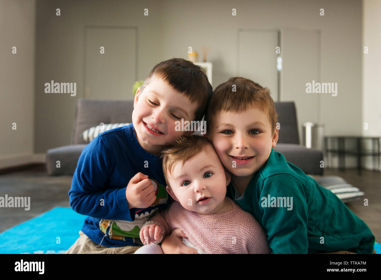 Portrait of happy siblings at home Stock Photo - Alamy