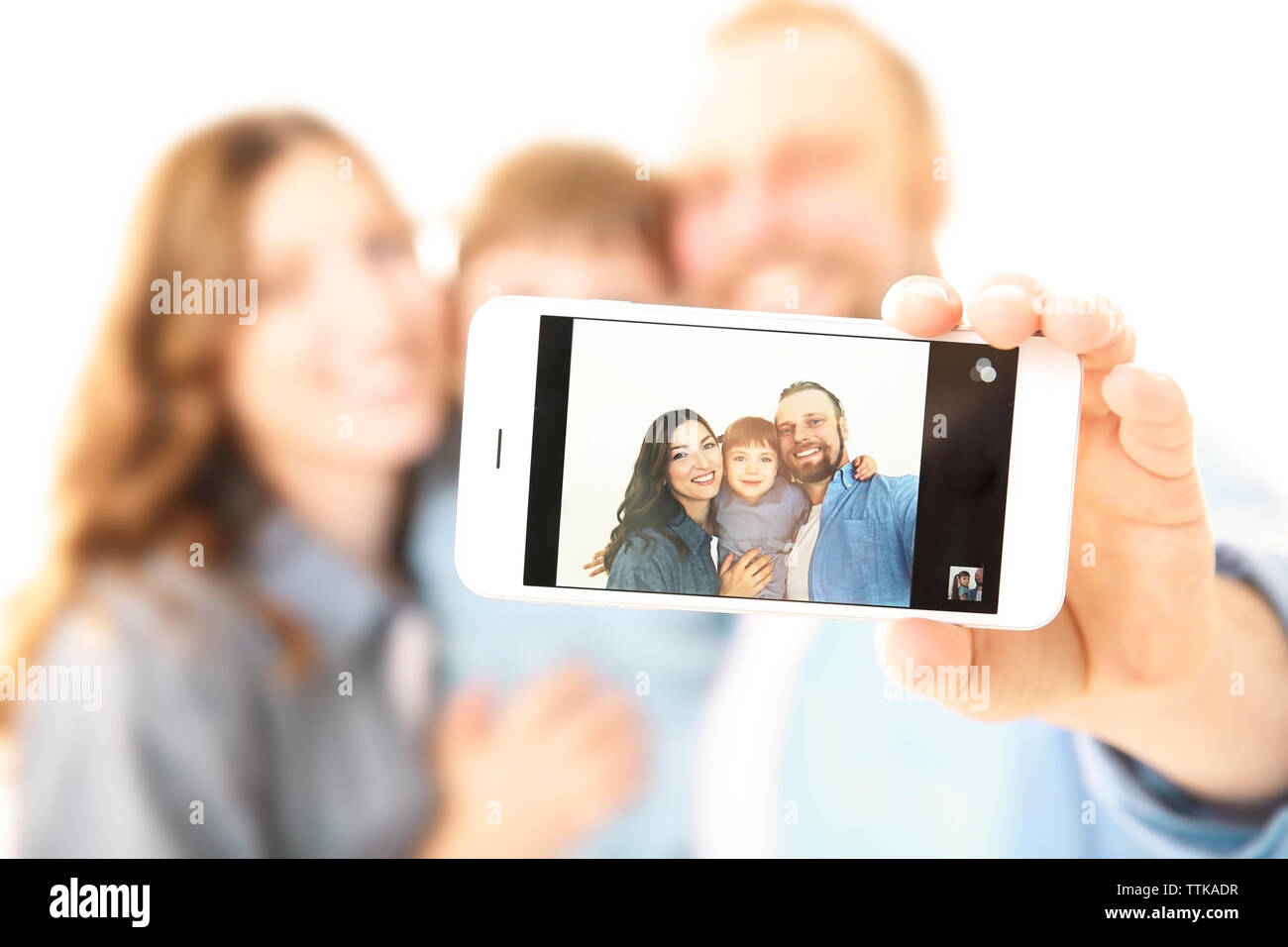 Happy family taking photo of themselves isolated on white Stock Photo ...