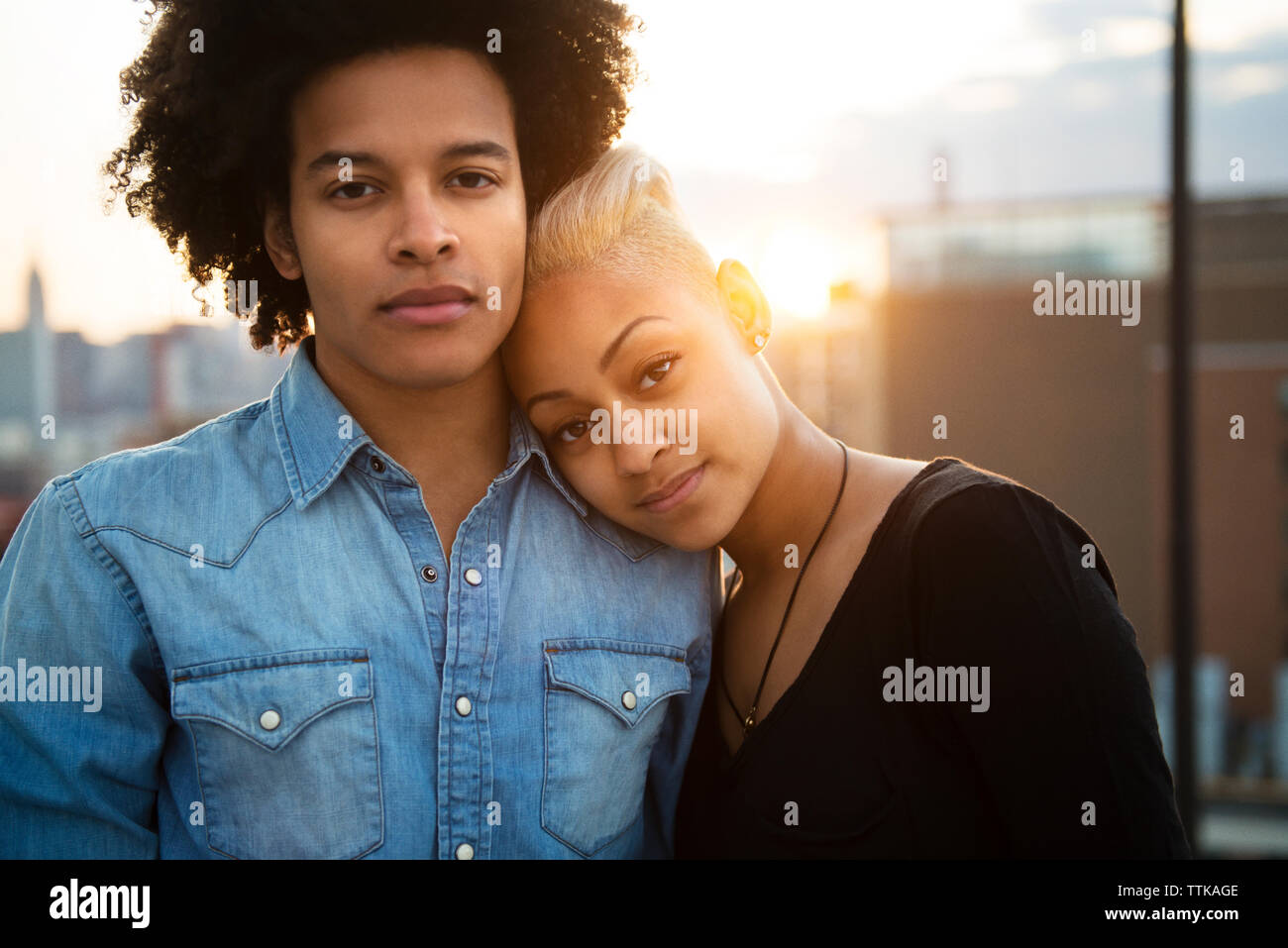 Couple sitting rooftop terrace hi-res stock photography and images - Alamy