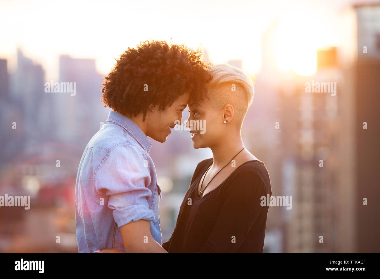 Woman standing on rooftop terrace hi-res stock photography and images ...