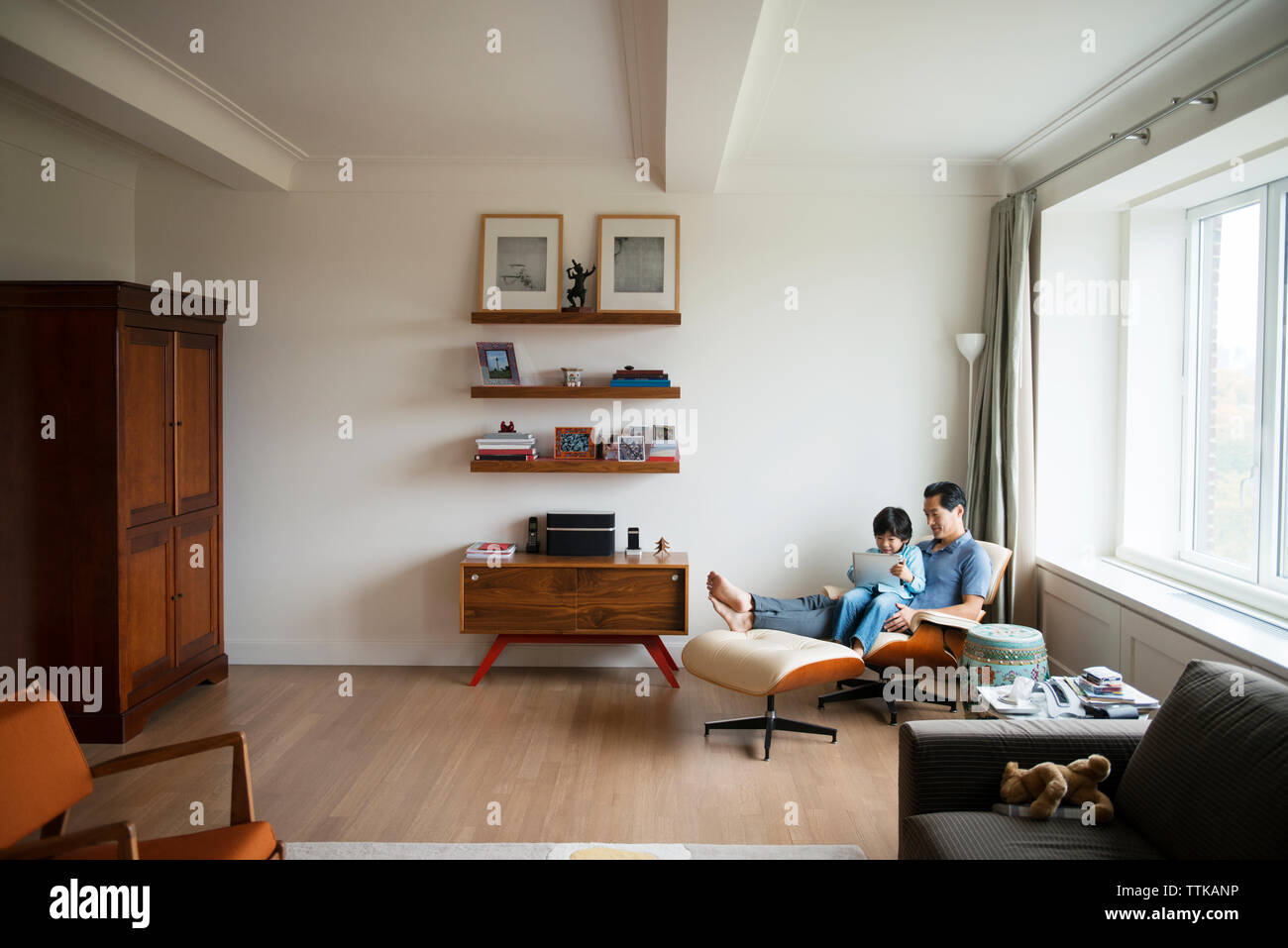 Father and son in living room hi-res stock photography and images - Alamy
