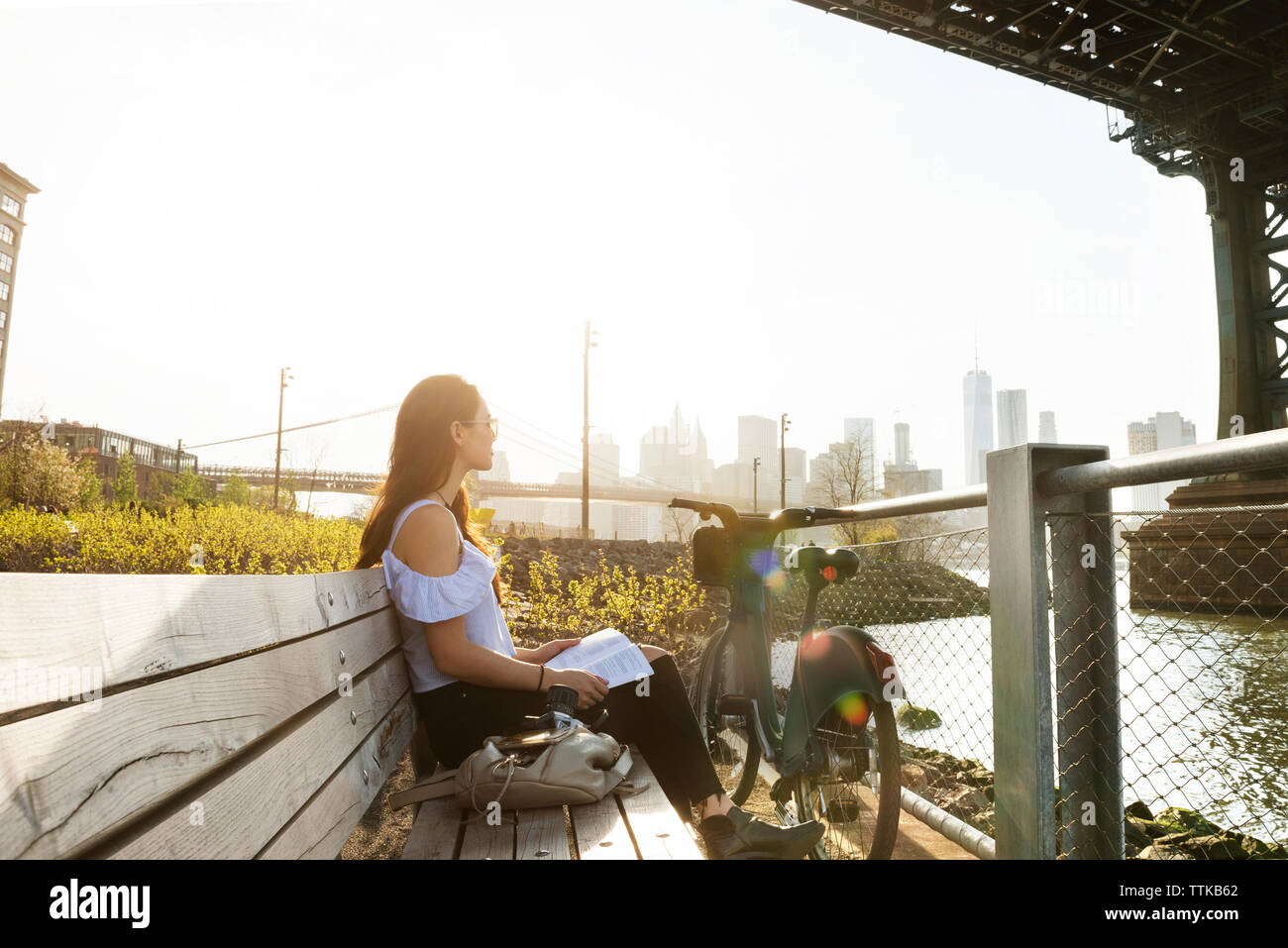 Bridge railing sitting woman hi-res stock photography and images - Alamy