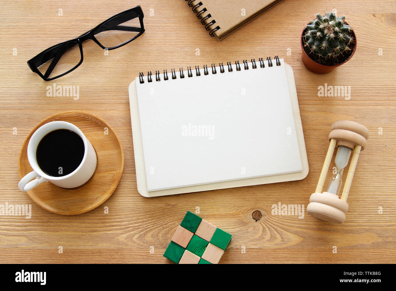 Open notebook with empty pages over wooden old office desk table. Top ...