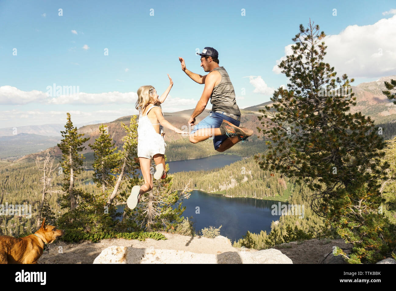 Couple jumping lake hi-res stock photography and images - Alamy