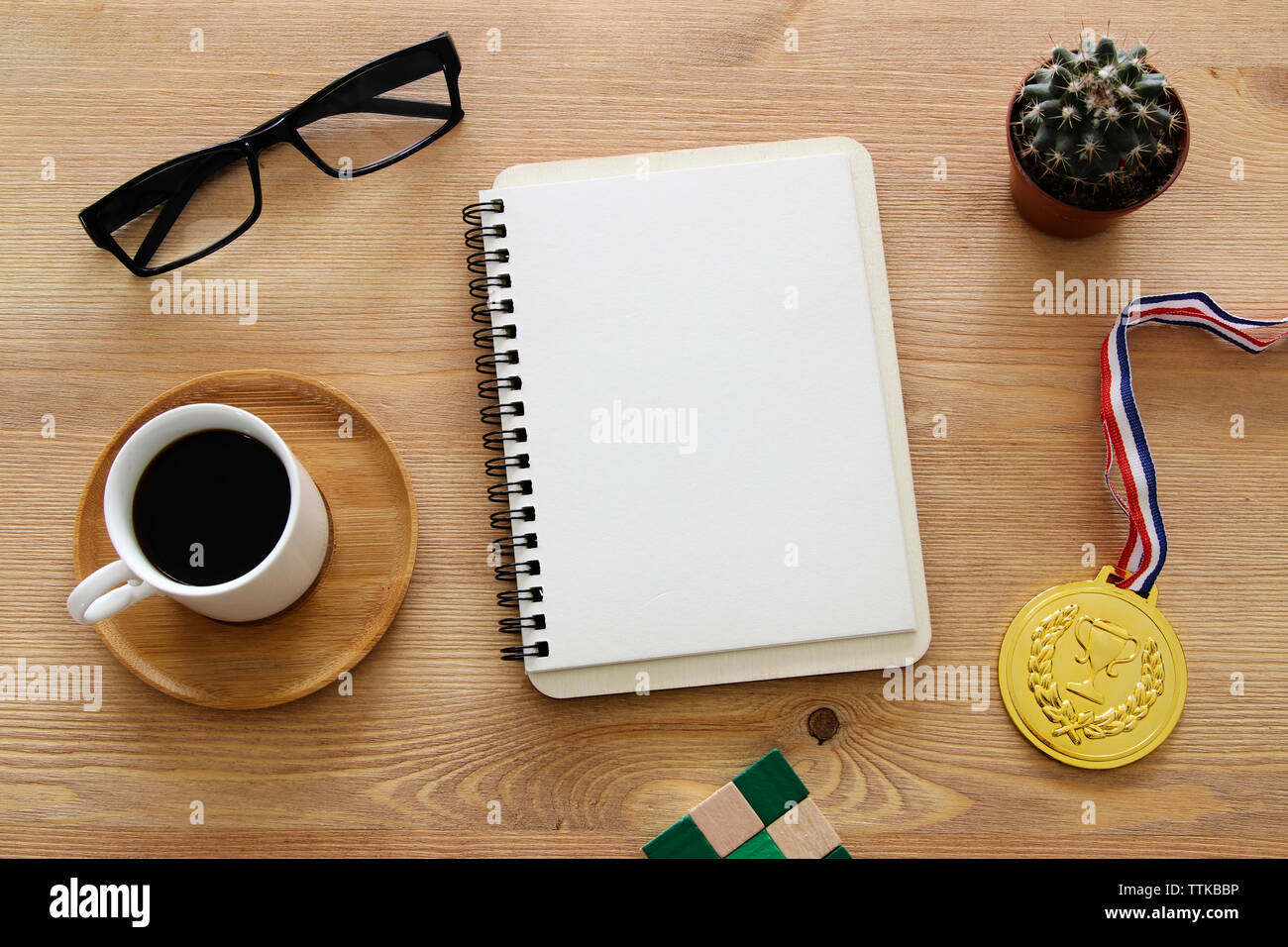 Open notebook with empty pages over wooden old office desk table. Top ...