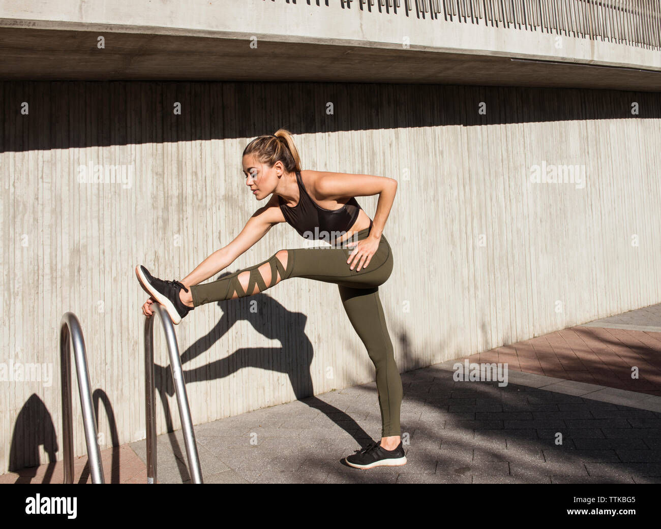 Woman legs up against wall hi-res stock photography and images - Alamy