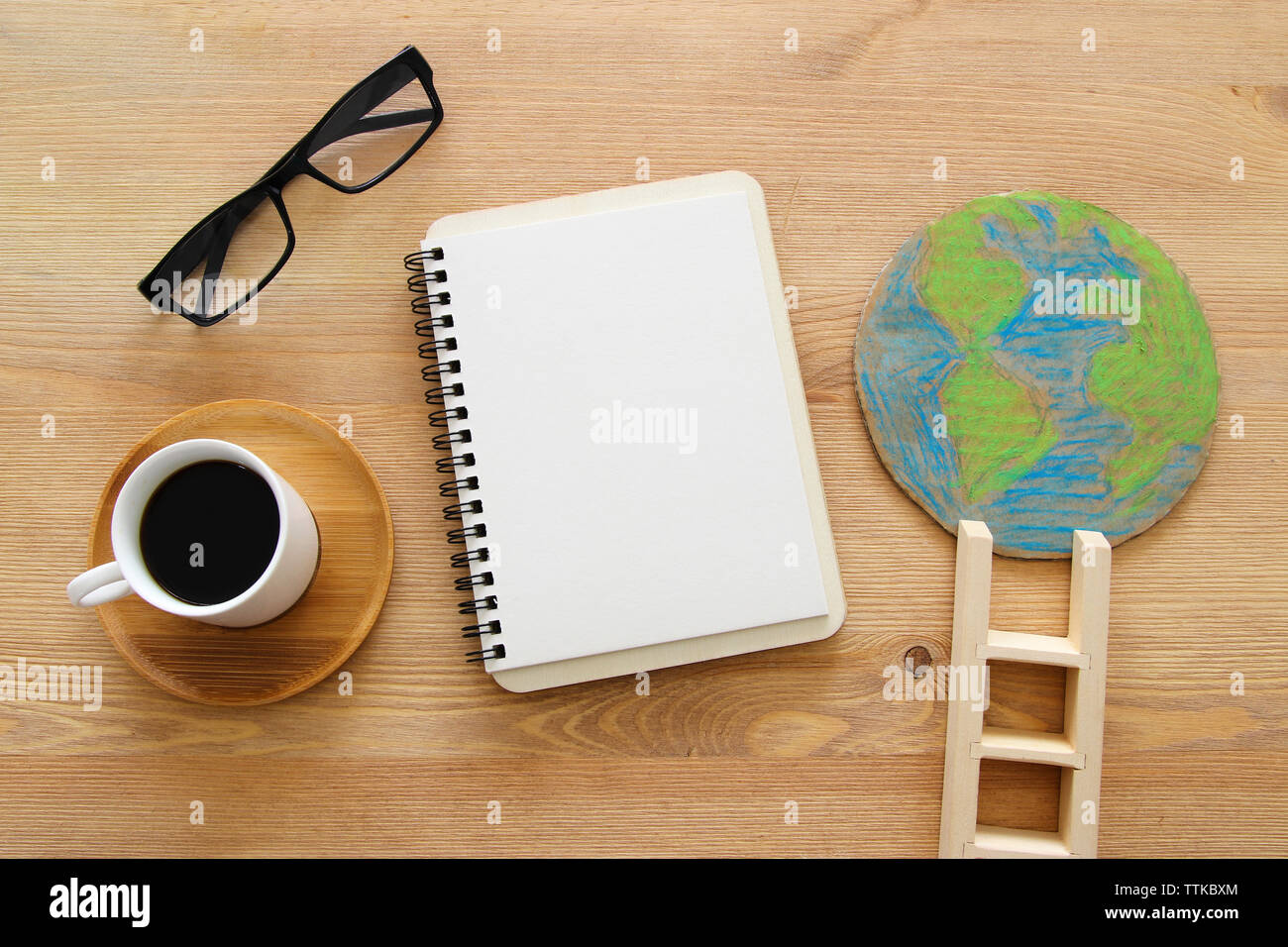 Open notebook with empty pages over wooden old office desk table. Top ...