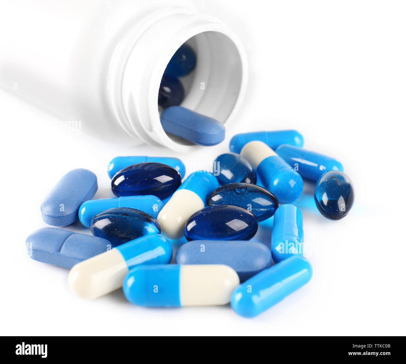 Blue pills isolated on white Stock Photo - Alamy