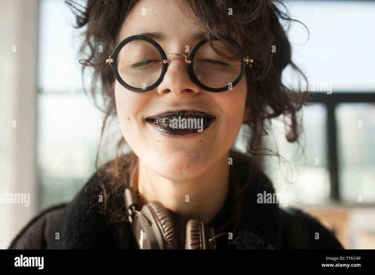 Close-up of woman with messy mouth eating ice cream at home Stock Photo ...