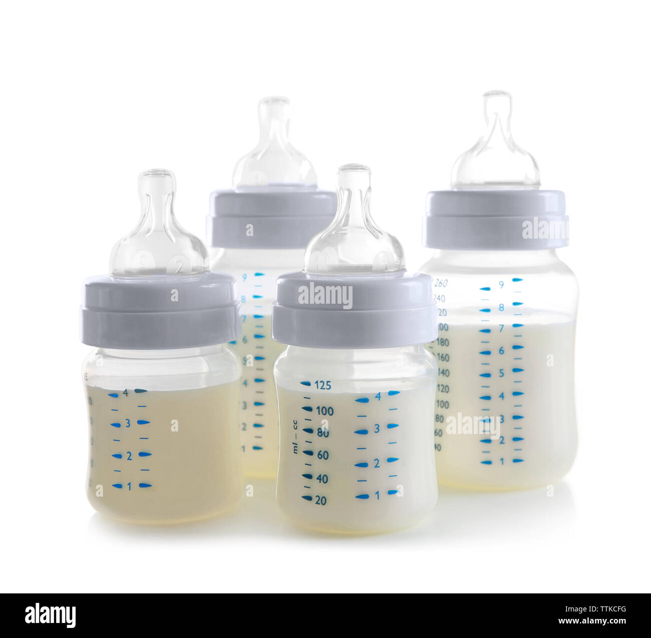 Baby milk bottles, isolated on white Stock Photo - Alamy