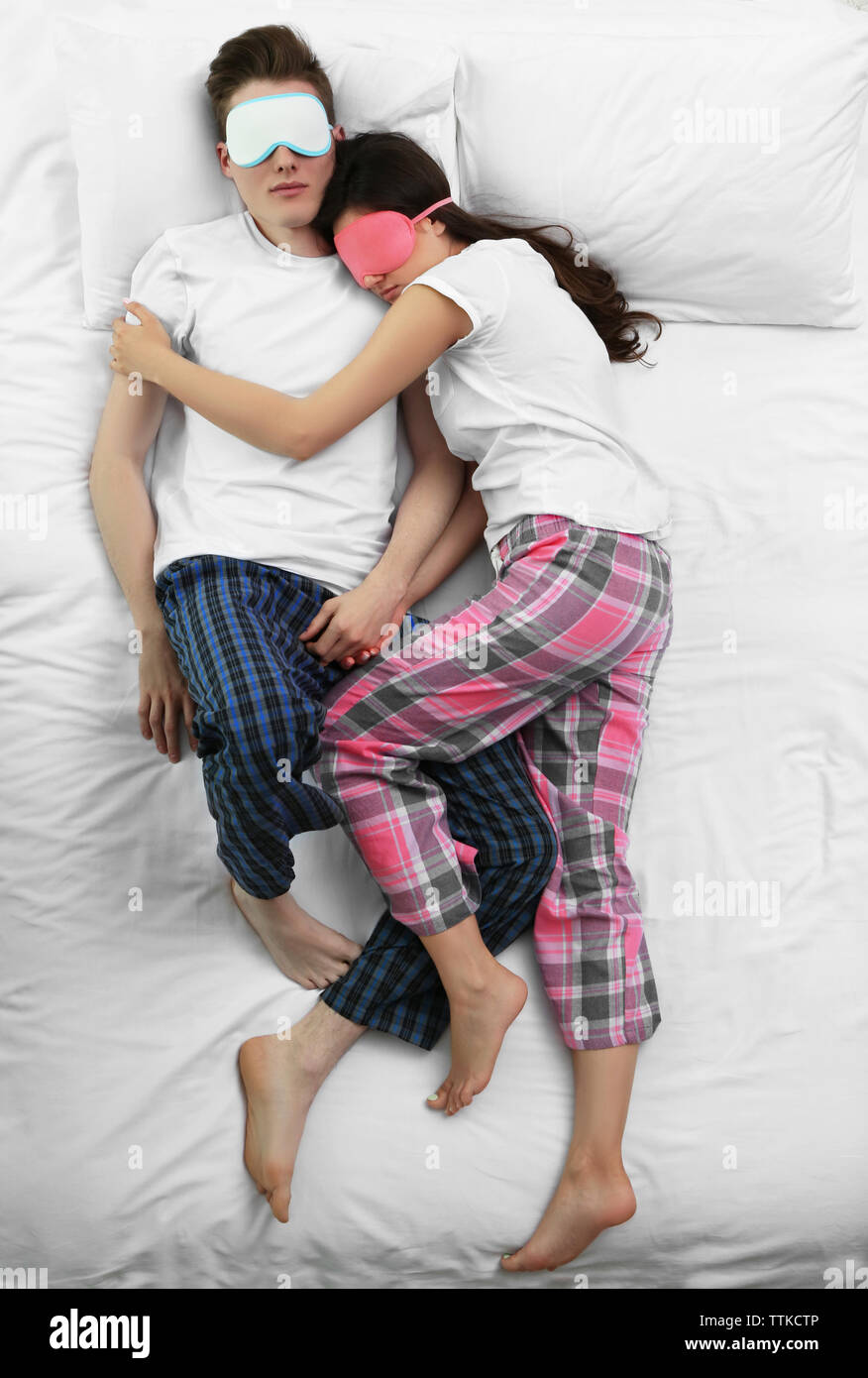 Sleeping couple, top view Stock Photo - Alamy