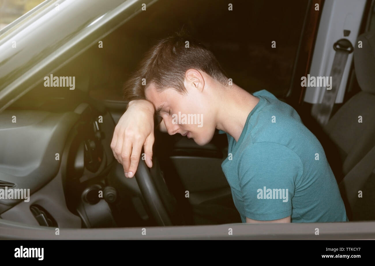 Handsome young man sleeping in car hi-res stock photography and images ...