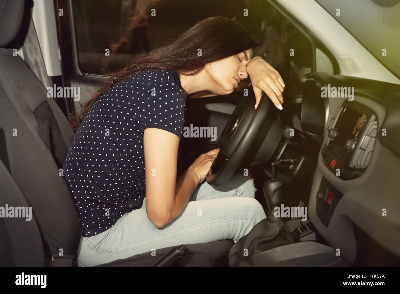 Beautiful girl falling asleep in car Stock Photo - Alamy