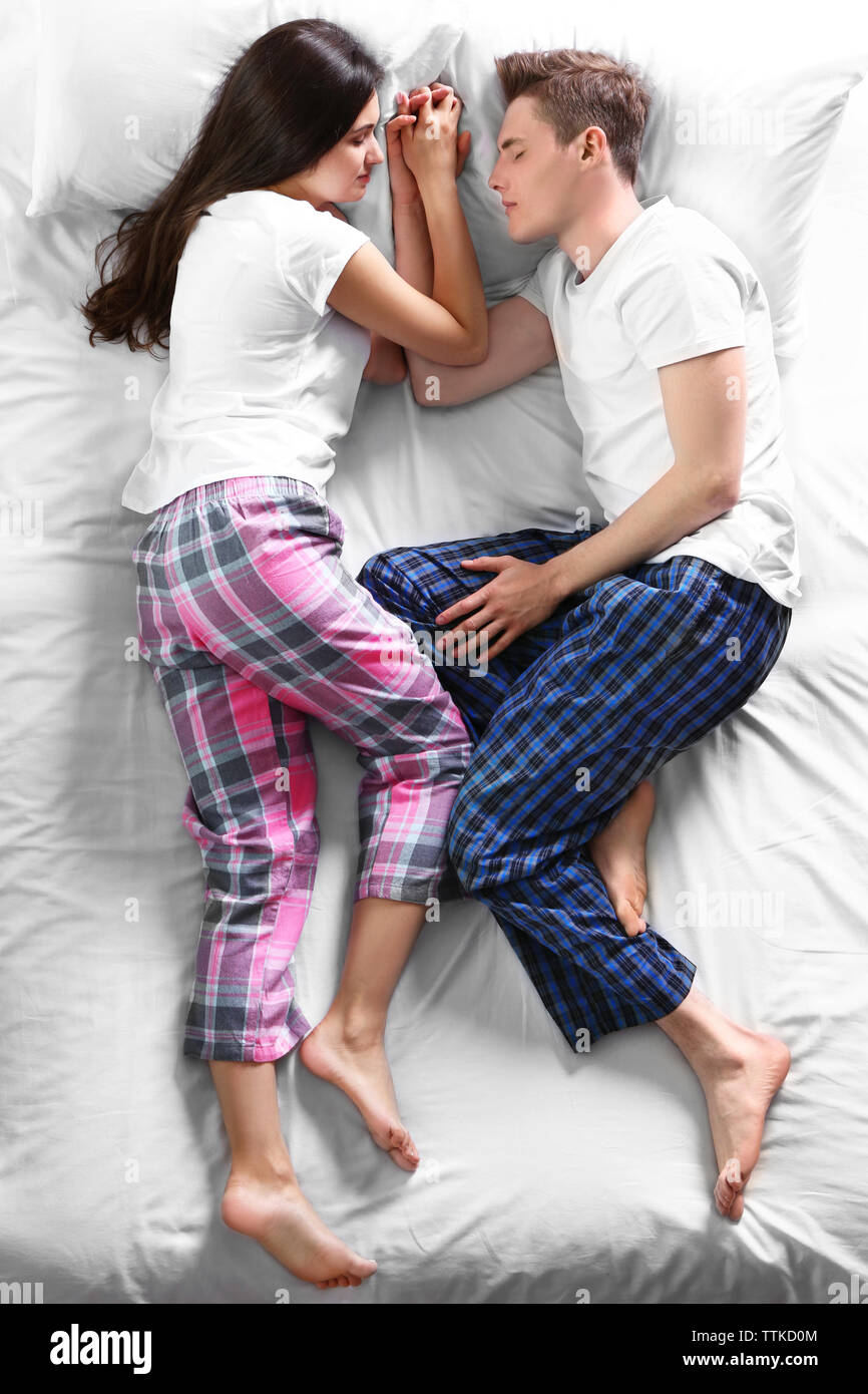 Sleeping couple, top view Stock Photo - Alamy