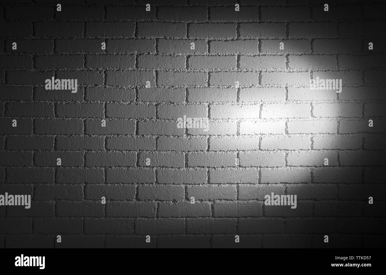 Light spot on white brick wall Stock Photo - Alamy