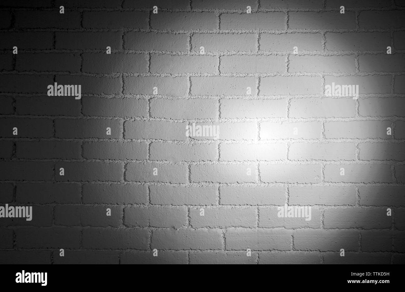 Light spot on white brick wall Stock Photo - Alamy