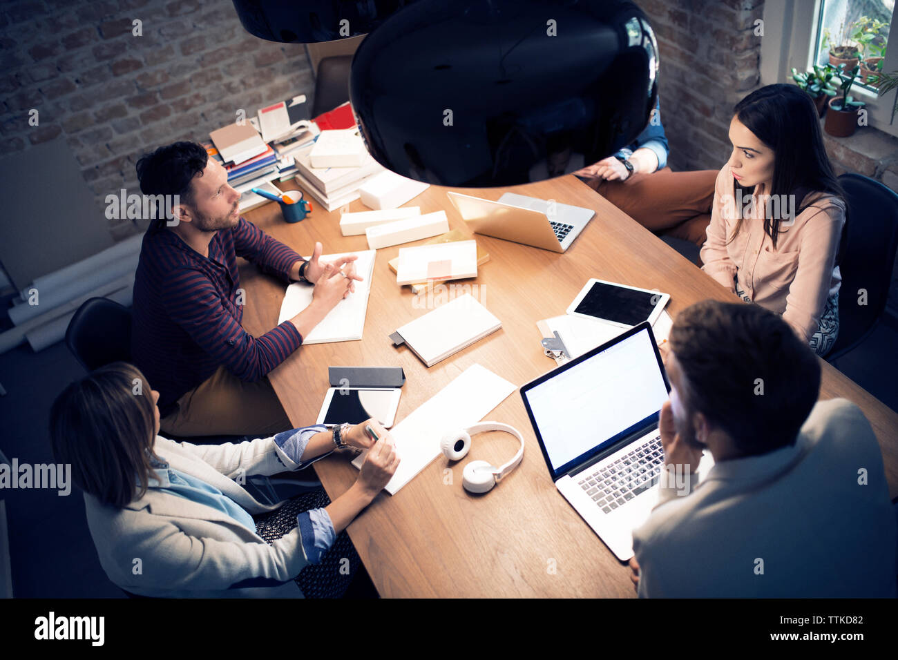Coworkers in discussion in high hi-res stock photography and images - Alamy