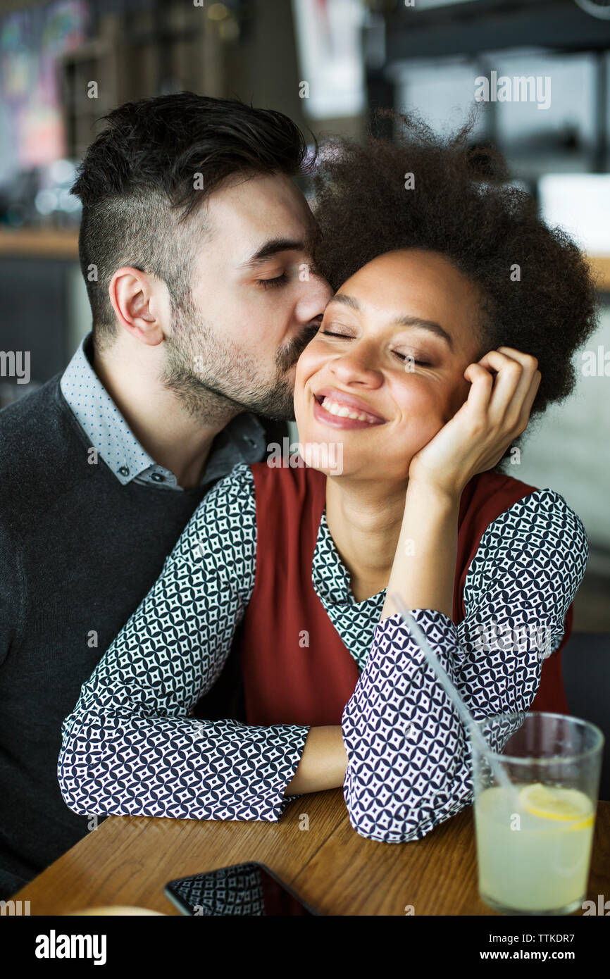Handsome male kissing woman on hi-res stock photography and images - Alamy