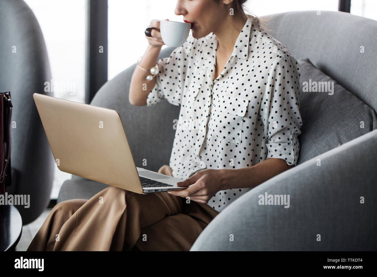 Drinking and working hi-res stock photography and images - Alamy