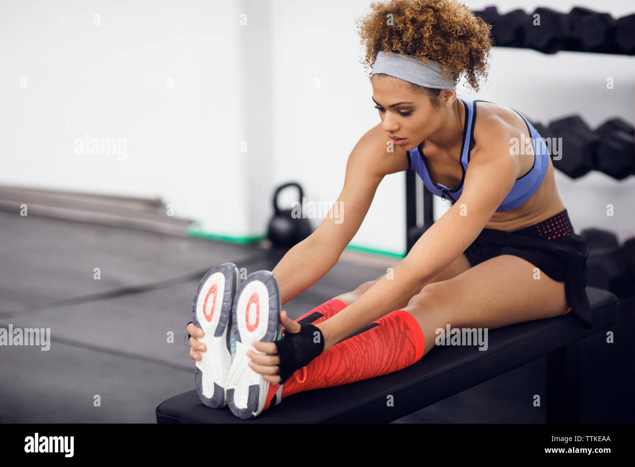 Female athlete sitting on bench hi-res stock photography and images - Alamy