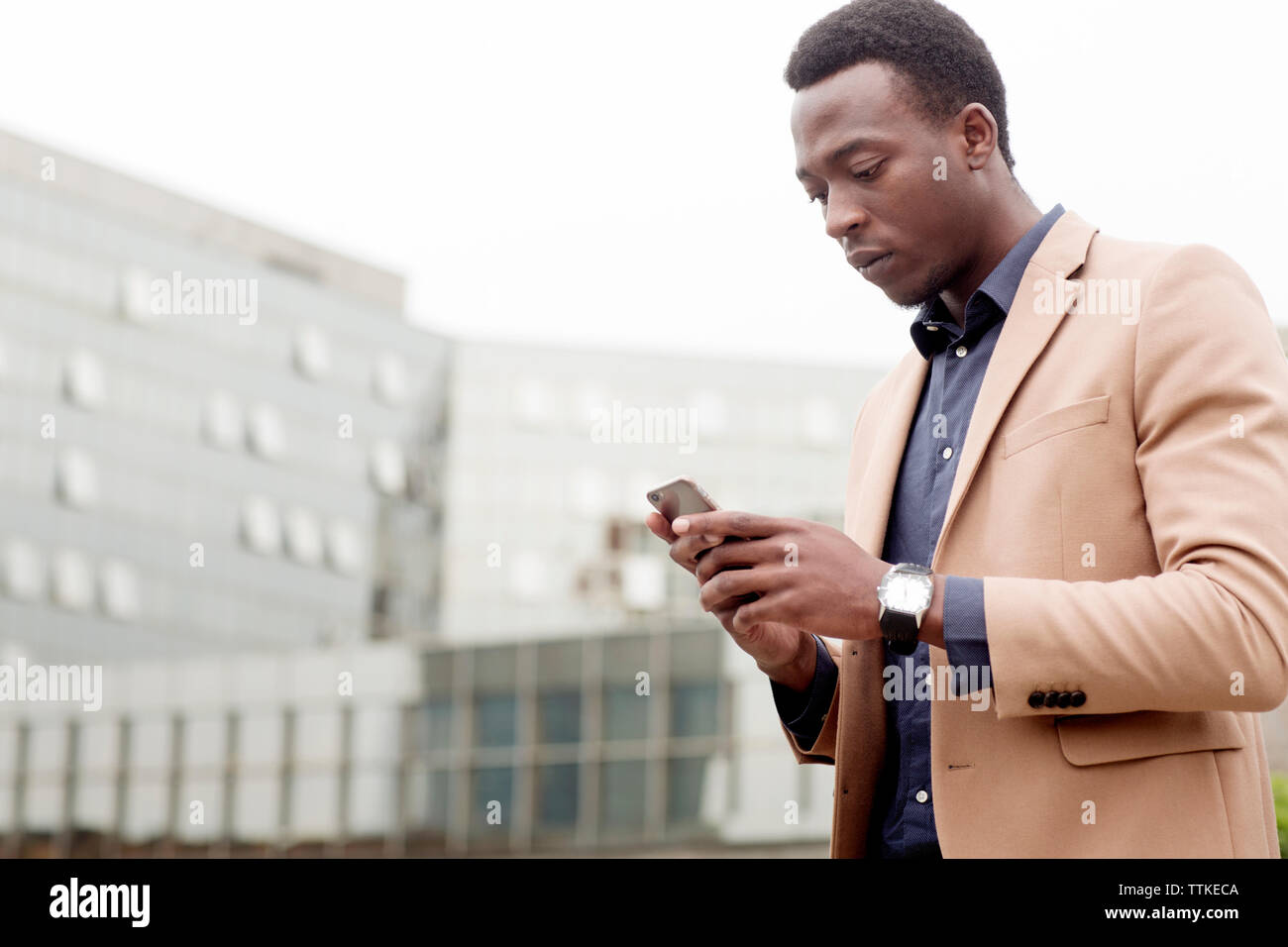 businessman using smart phone in city Stock Photo - Alamy