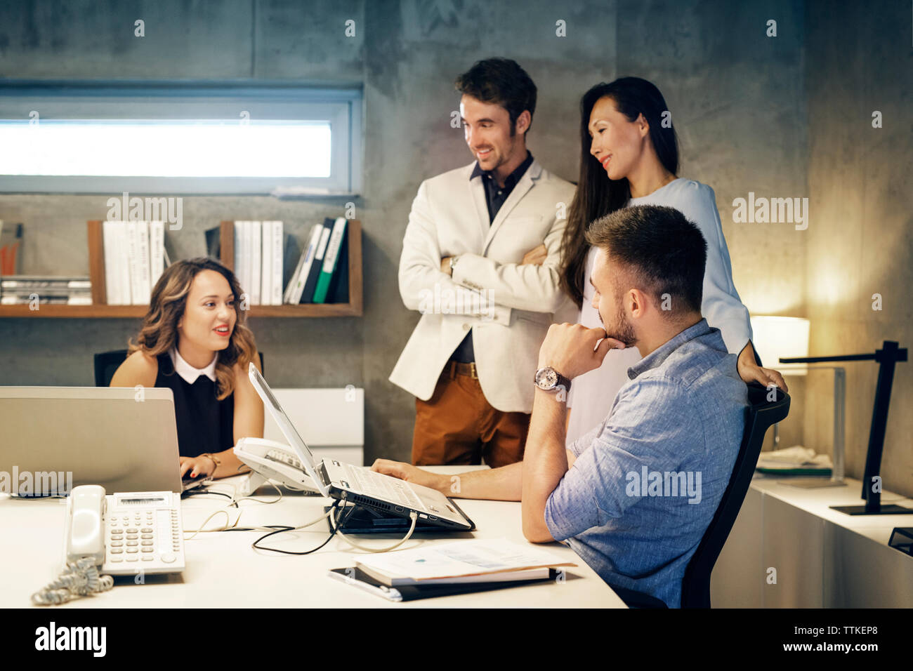 businesswoman explaining colleagues during meeting in office Stock ...
